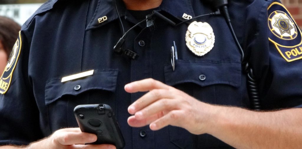 Officer Holding Cell Phone - TeamAlert Panic Button - Safety and ...